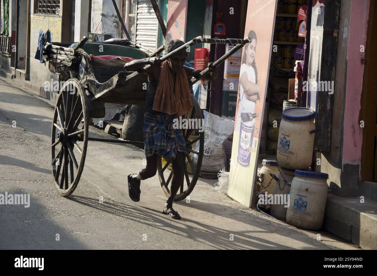 Man pulling hand rickshaw Kolkata West Bengal India Asia Stock Photo ...