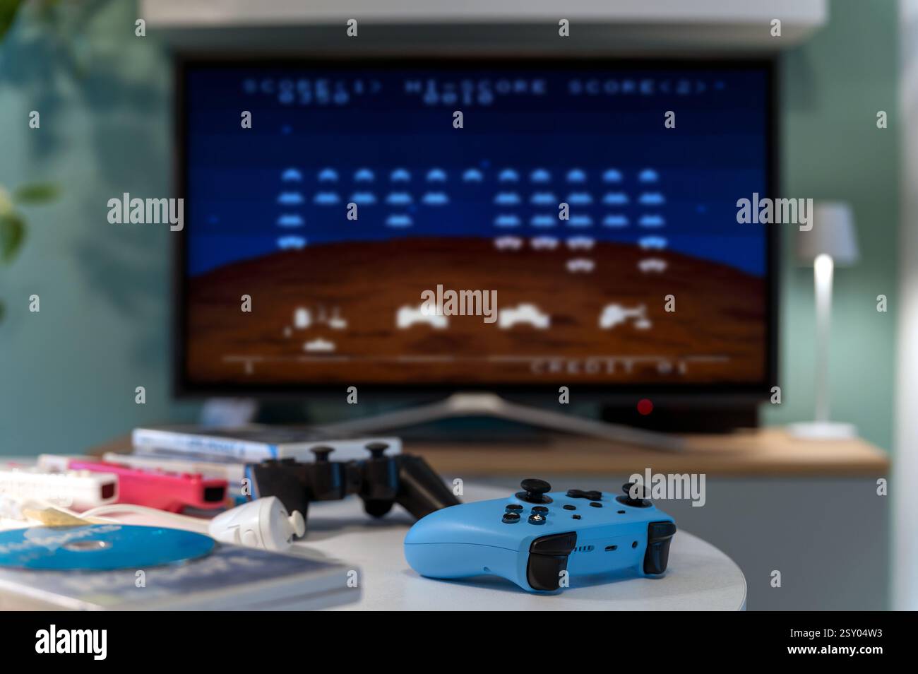 Milan, Lombardy, Italy - February 24, 2025: Light blue gamepad playing ...