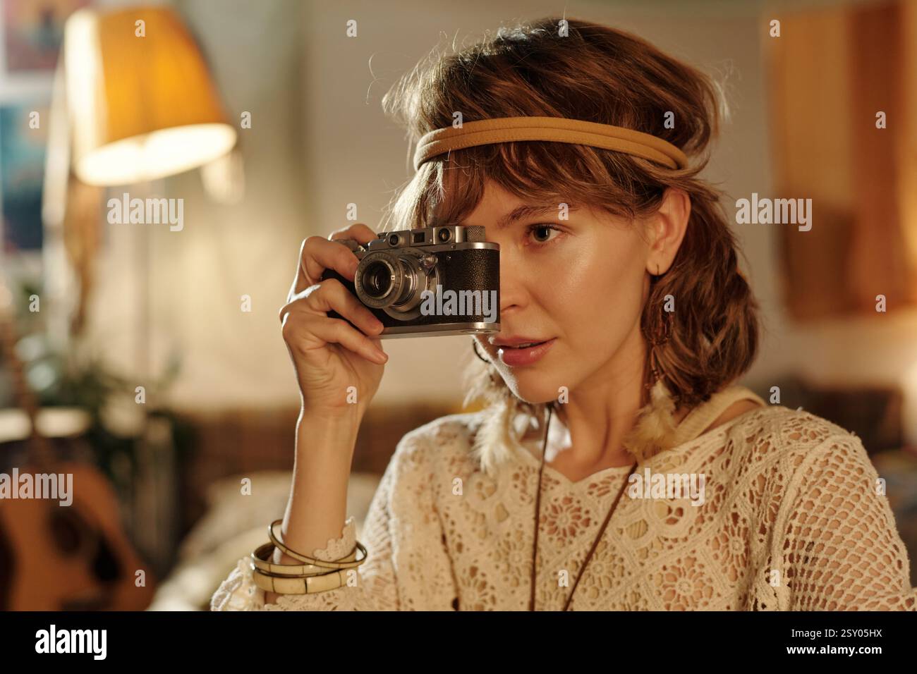 Capturing Moment with Vintage Camera at Home Stock Photo - Alamy