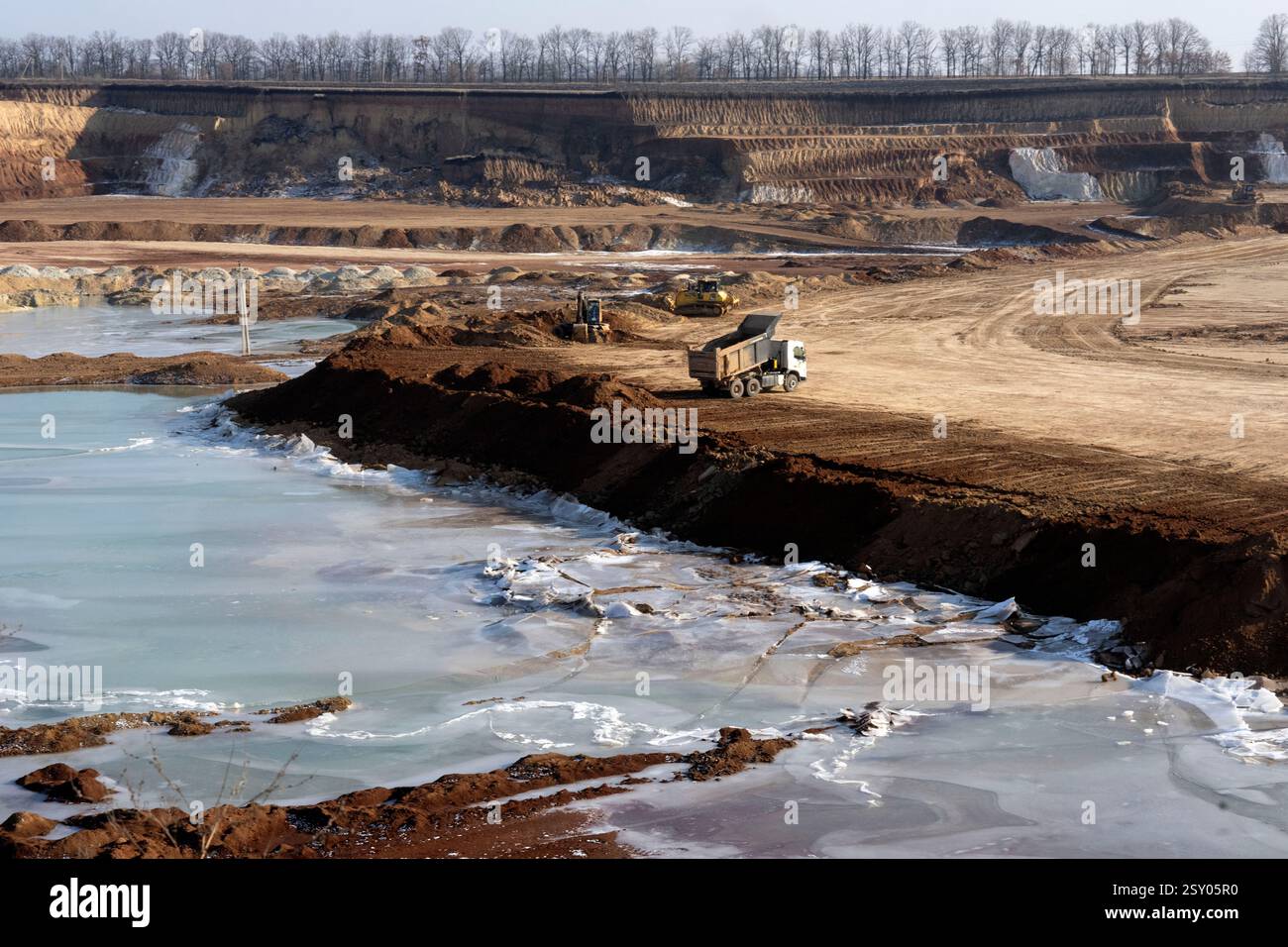 A view of an ilmenite open pit mine in a canyon in the central region ...