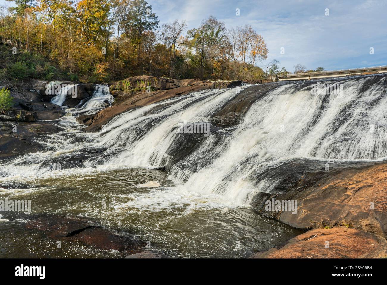 A view of the Towaliga River waterfalls cascading downstream after flowing under the High Falls ...