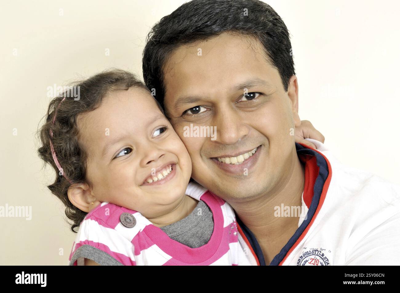 Father hugging daughter touching cheeks, India, Asian, MR#736O, MR ...