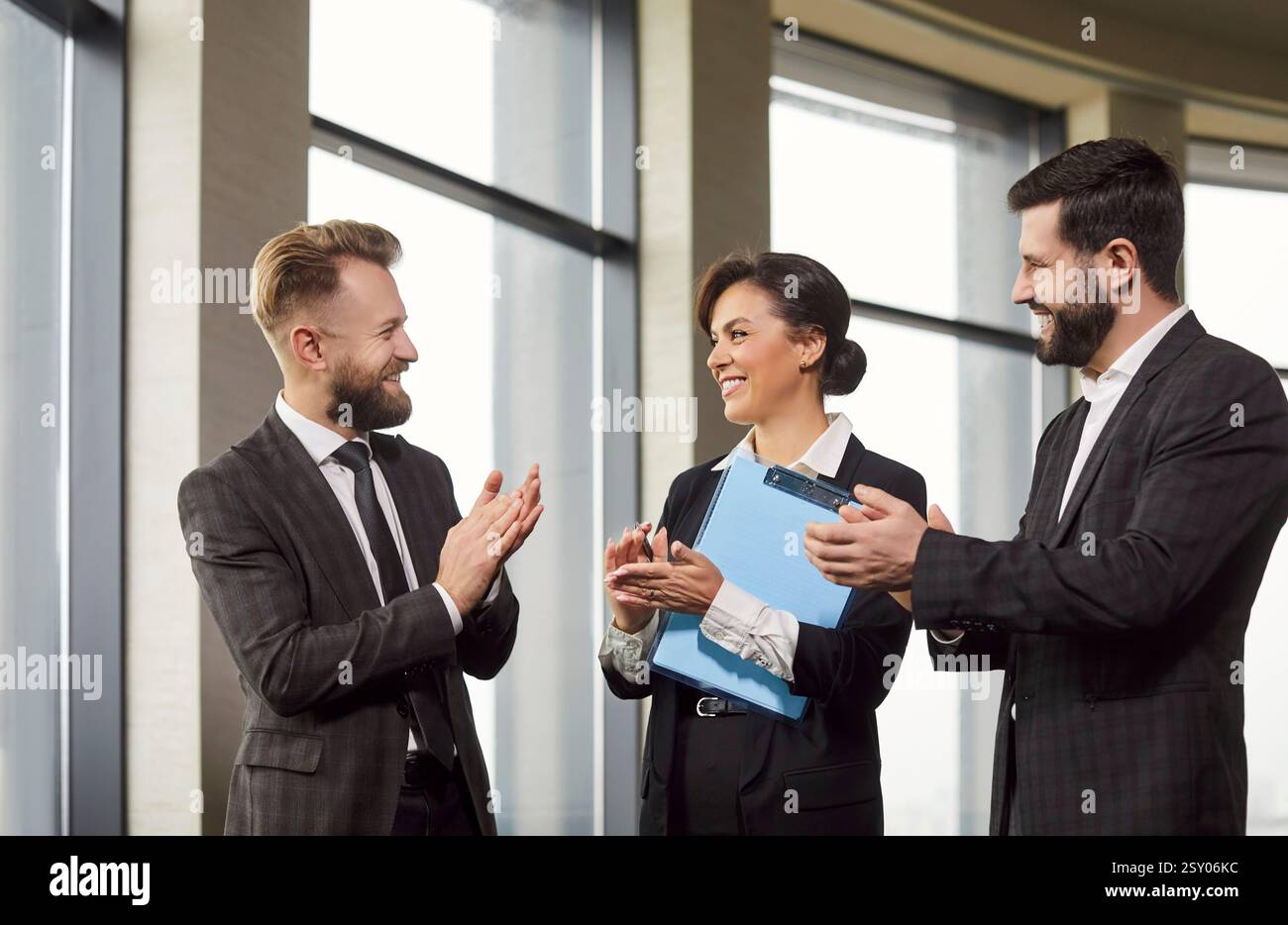 Boss applauding, encouraging, thanking happy employee for good job ...