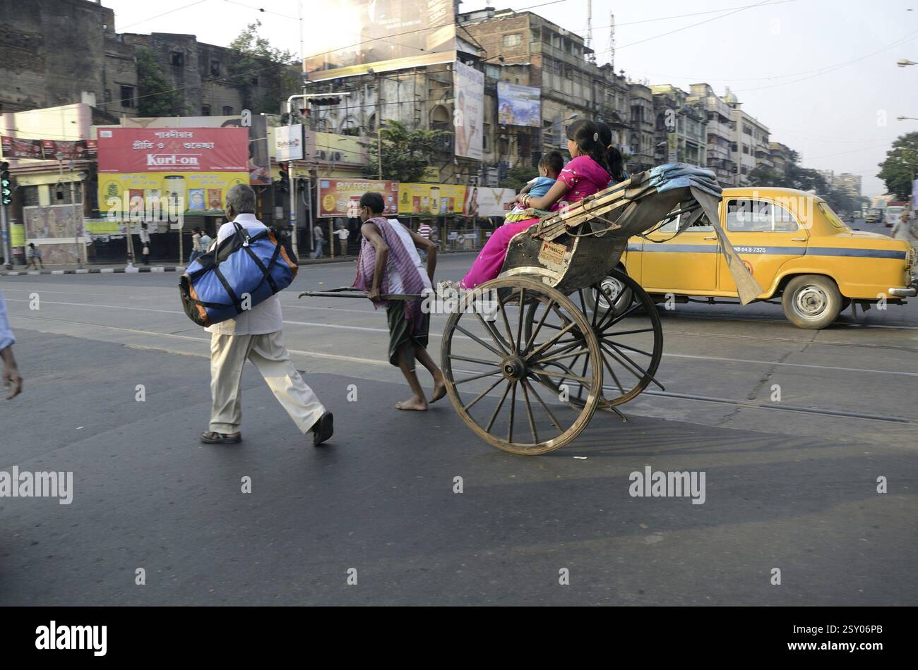 Hand rickshaw puller with passengers at Kolkata India Stock Photo - Alamy