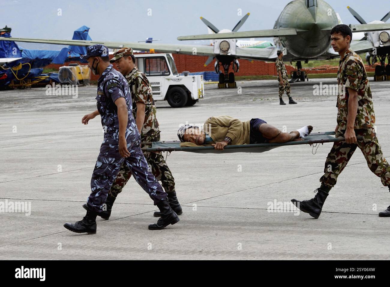 Army personnel carrying injured person, nepal, asia Stock Photo - Alamy