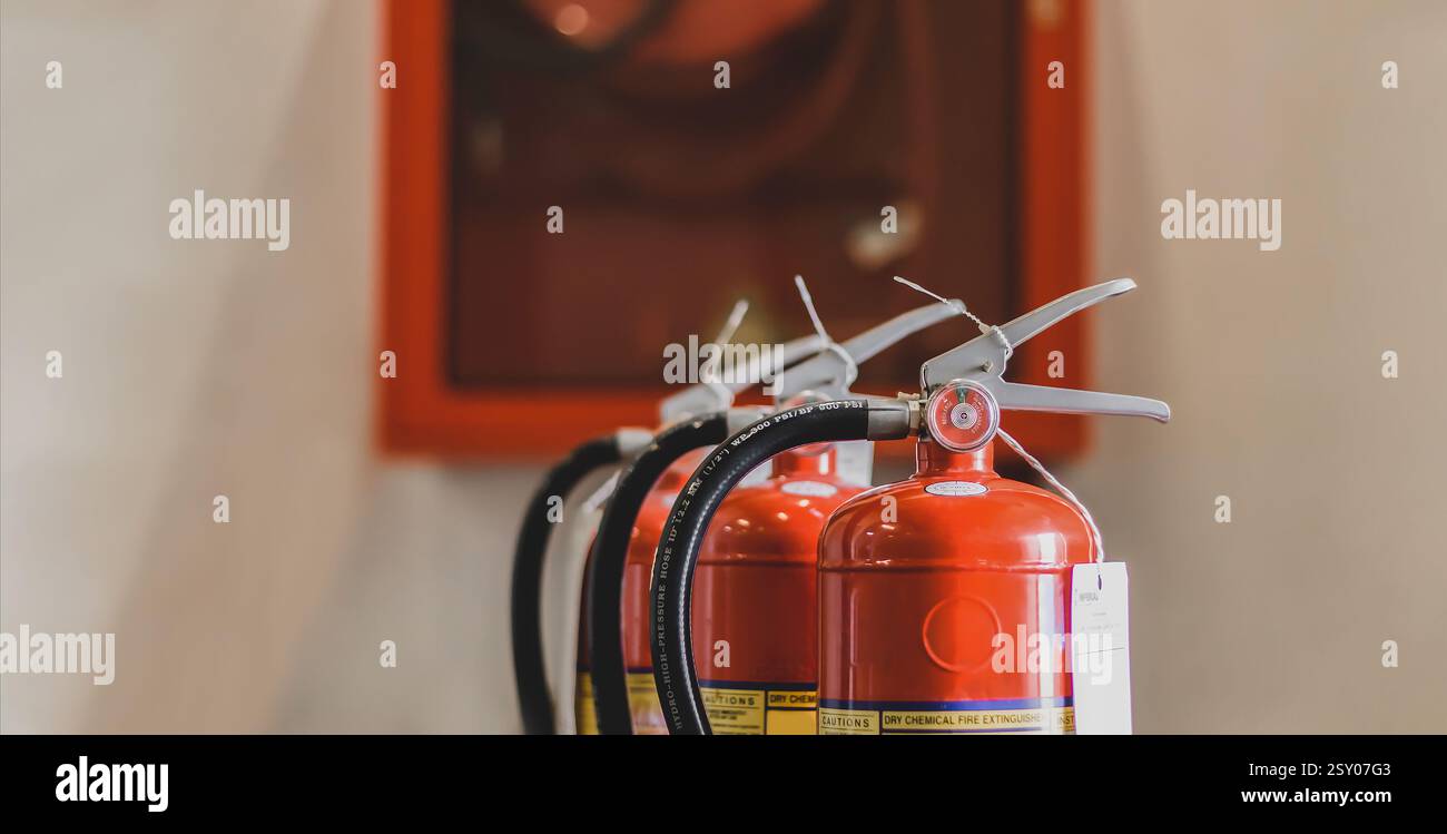 Red tank of fire extinguisher Stock Photo - Alamy