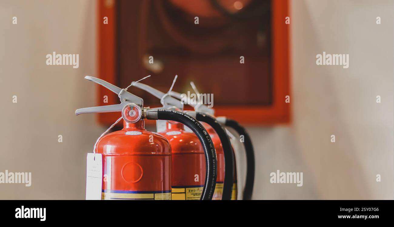 Red tank of fire extinguisher Stock Photo - Alamy