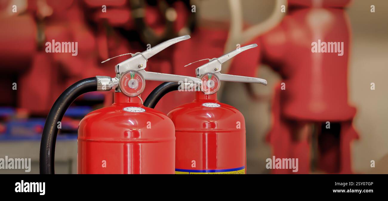 The red fire extinguisher is ready for use in case of an indoor fire ...