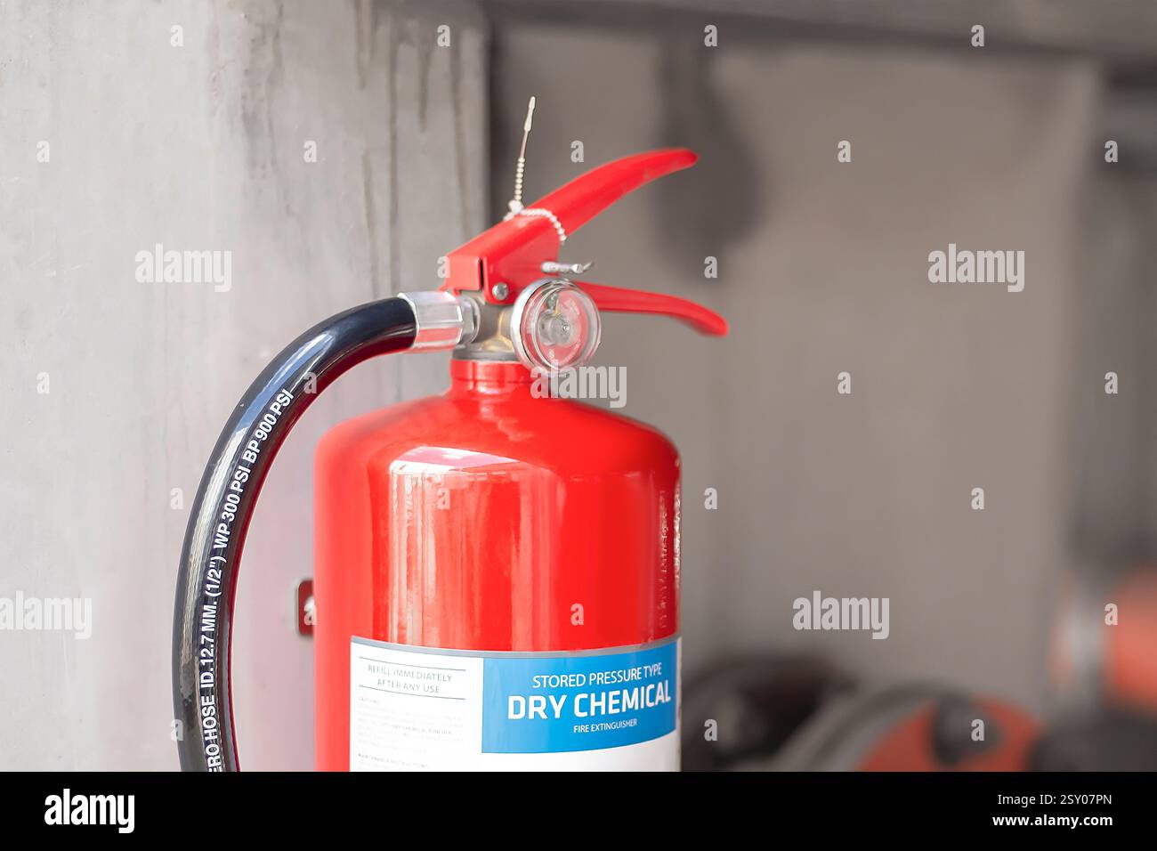 Red tank of fire extinguisher Stock Photo - Alamy