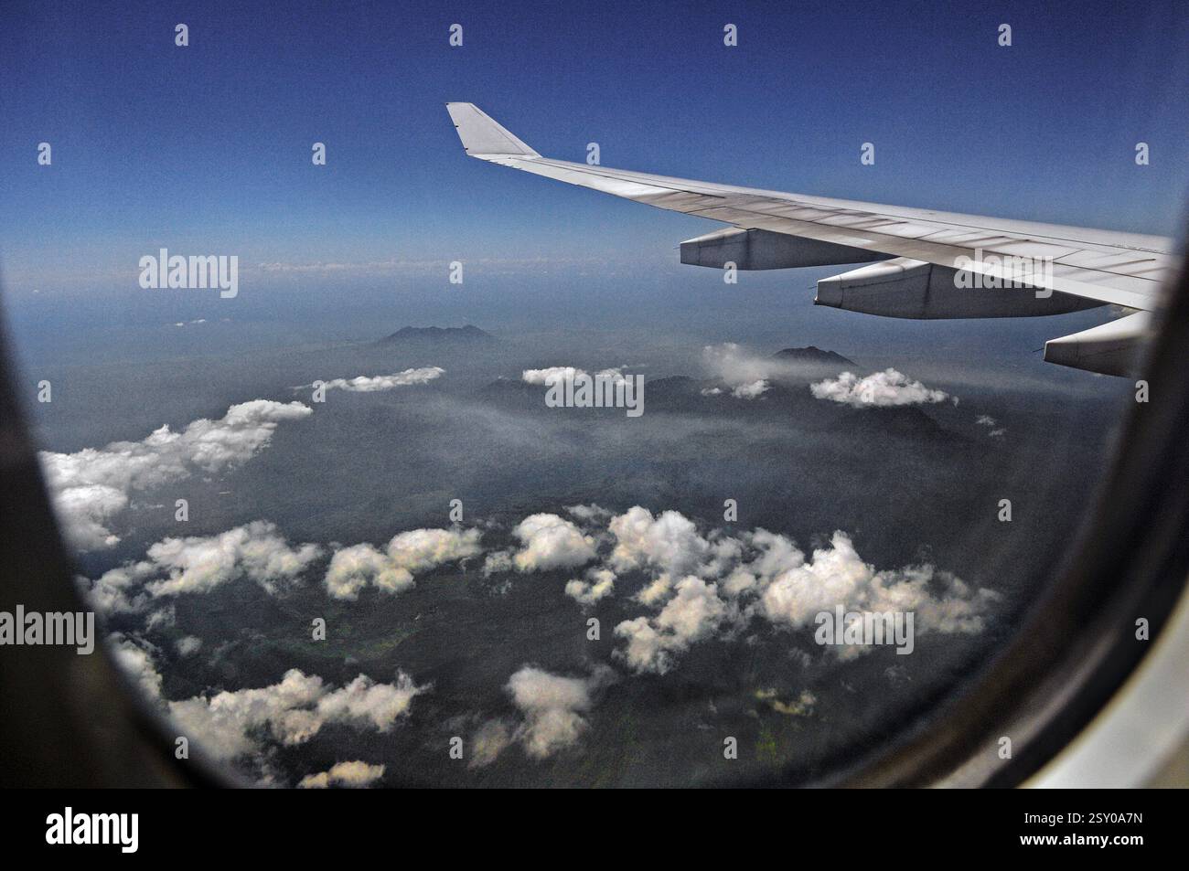 Aerial view, wing with winglet and volcanoes on the Malay Peninsula ...