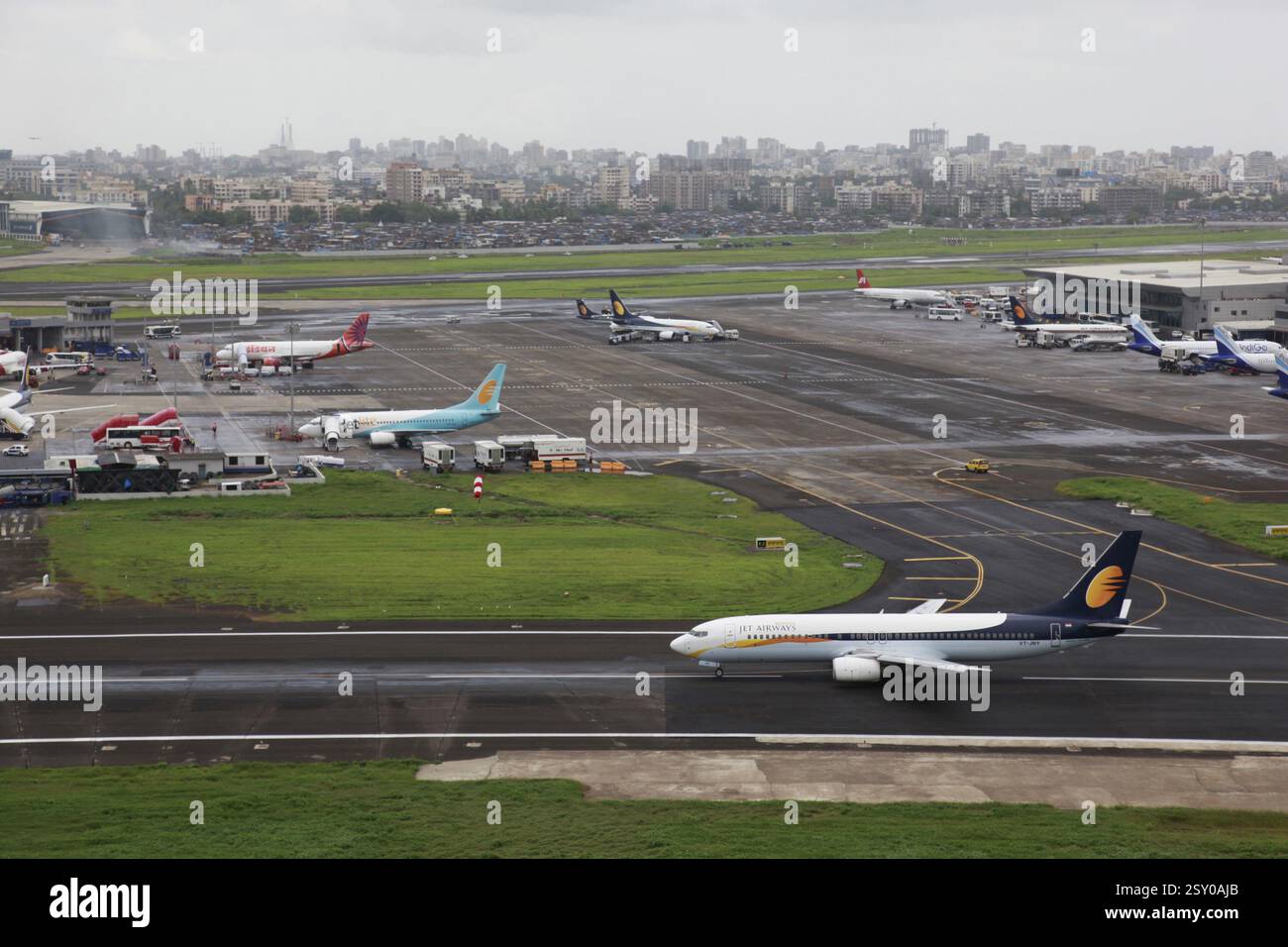 Plane taxing at mumbai airport Stock Photo - Alamy