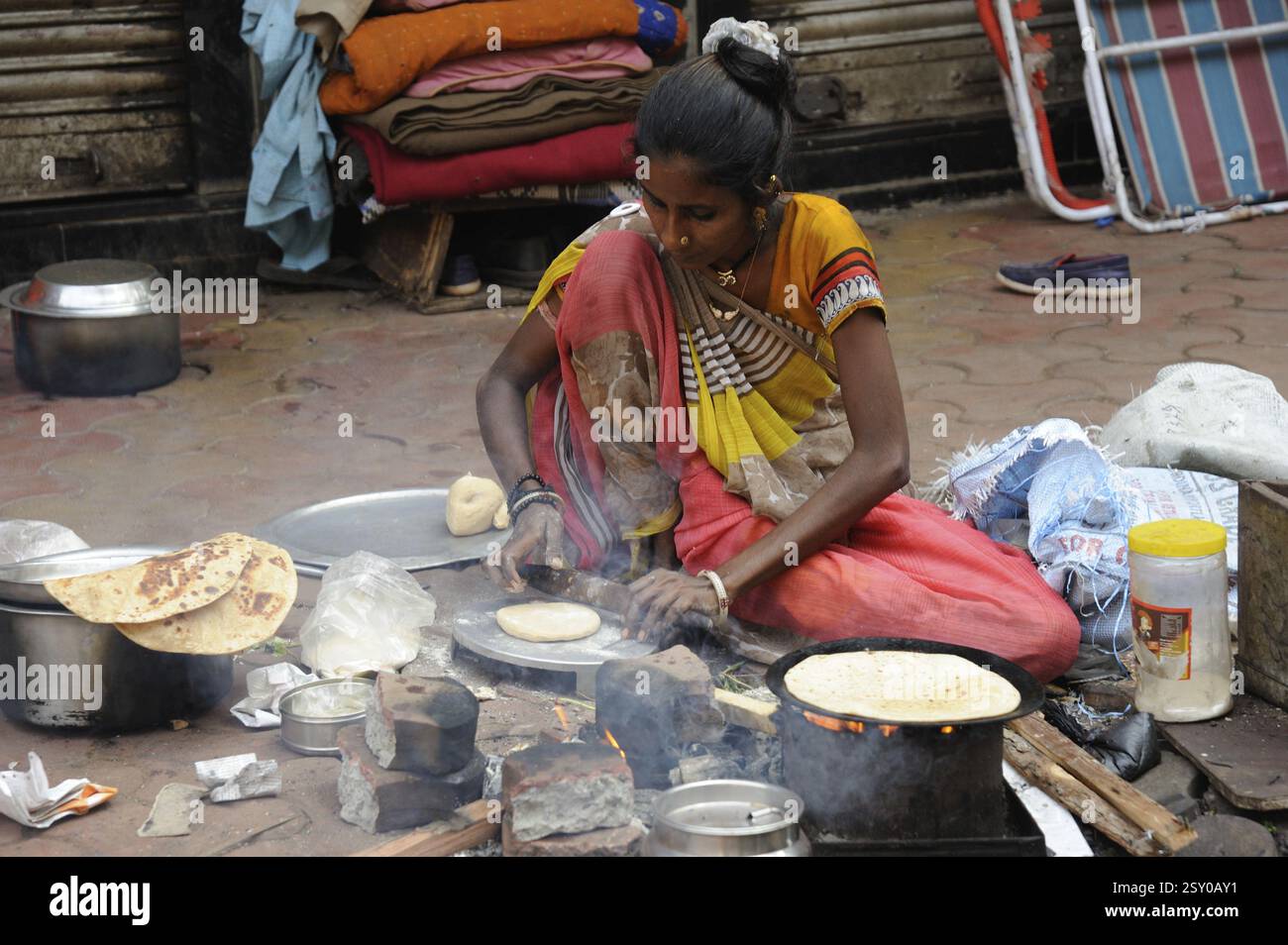 Indian lady cooking hi-res stock photography and images - Alamy