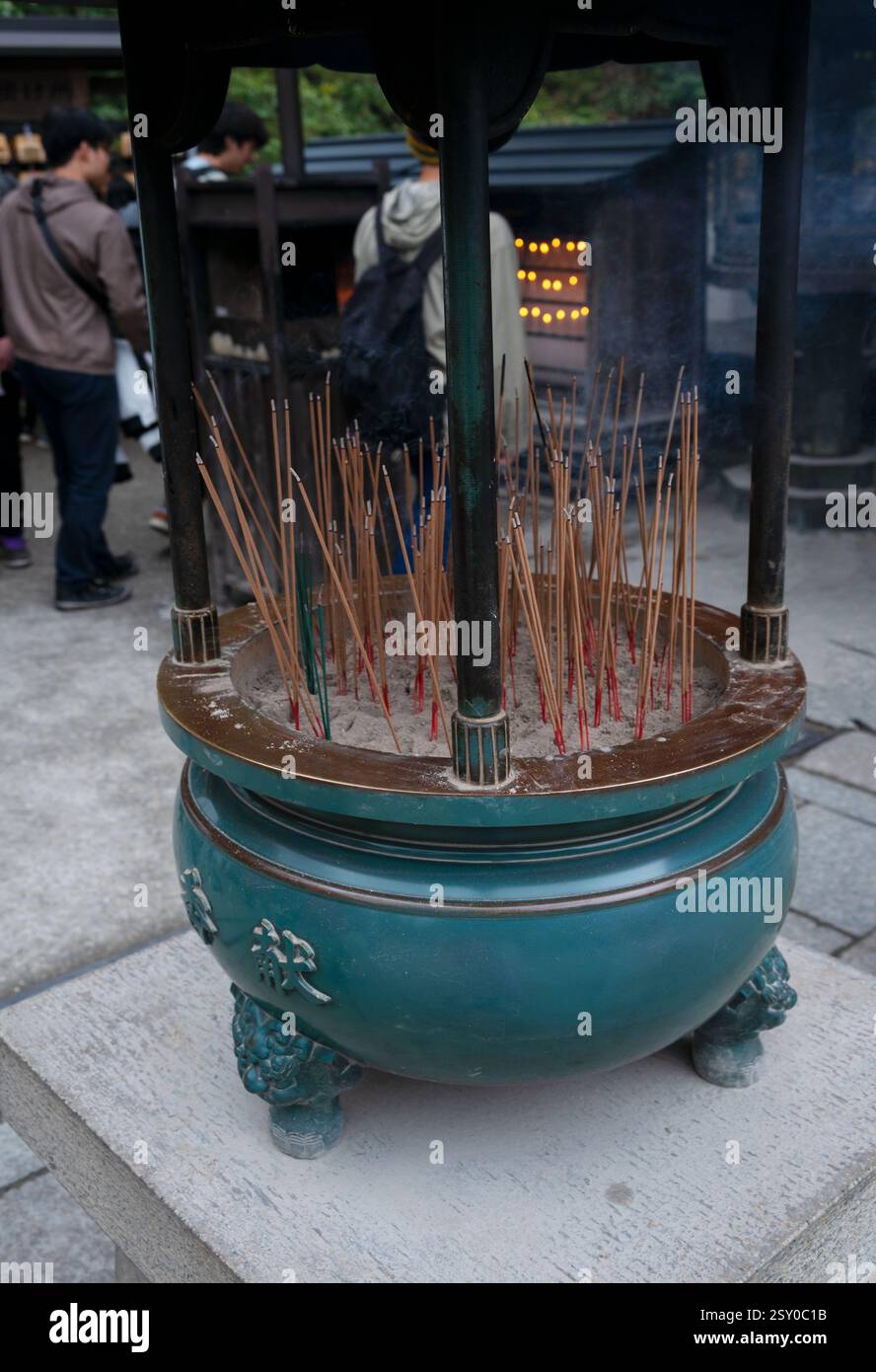 Incense sticks burning inside the temple complex of Kinkaku-ji ('Temple ...