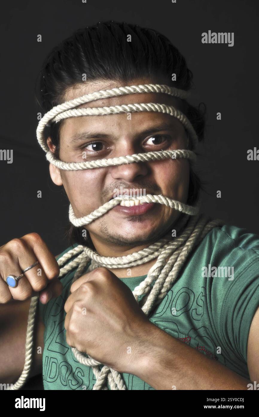 Man giving pose tied rope on face jodhpur Rajasthan India MR#786 Stock ...