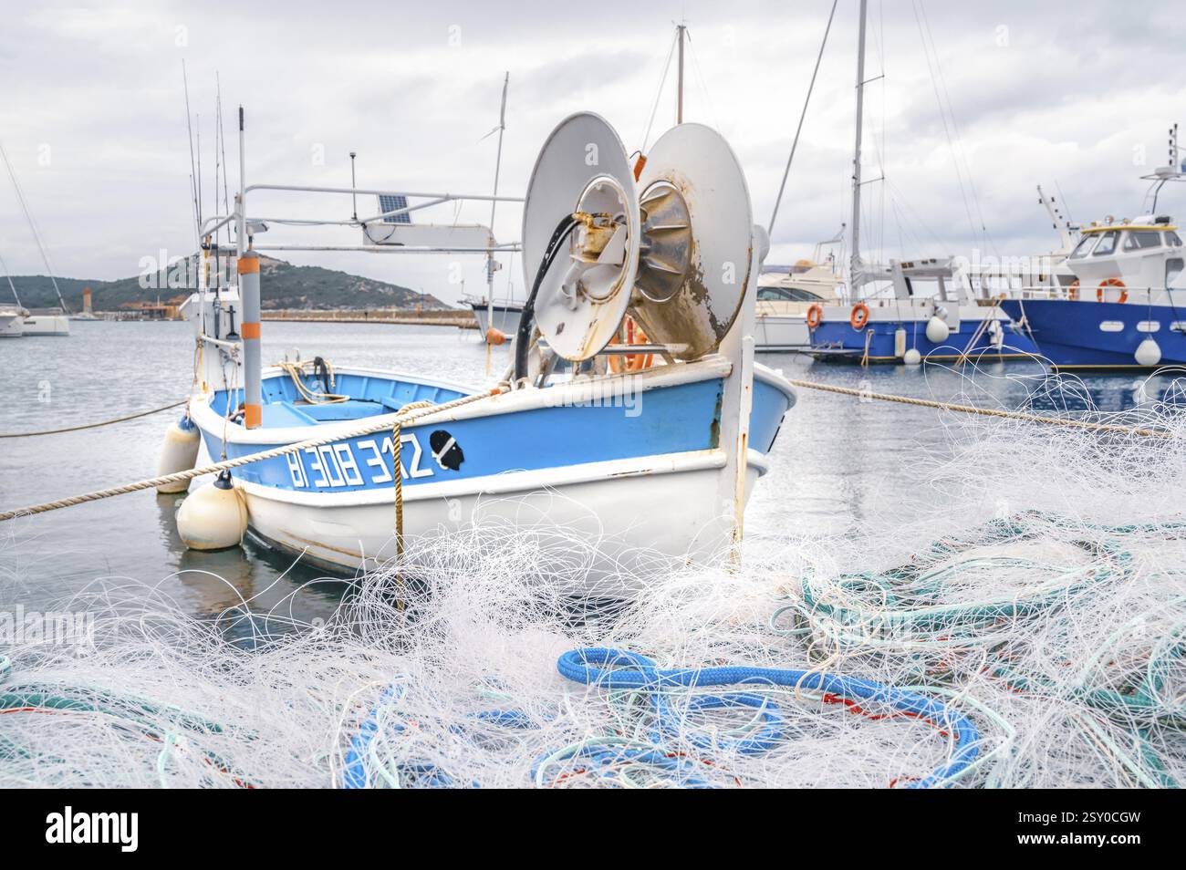 Still life with fishing boat and Corsican head on the bow and fishing ...