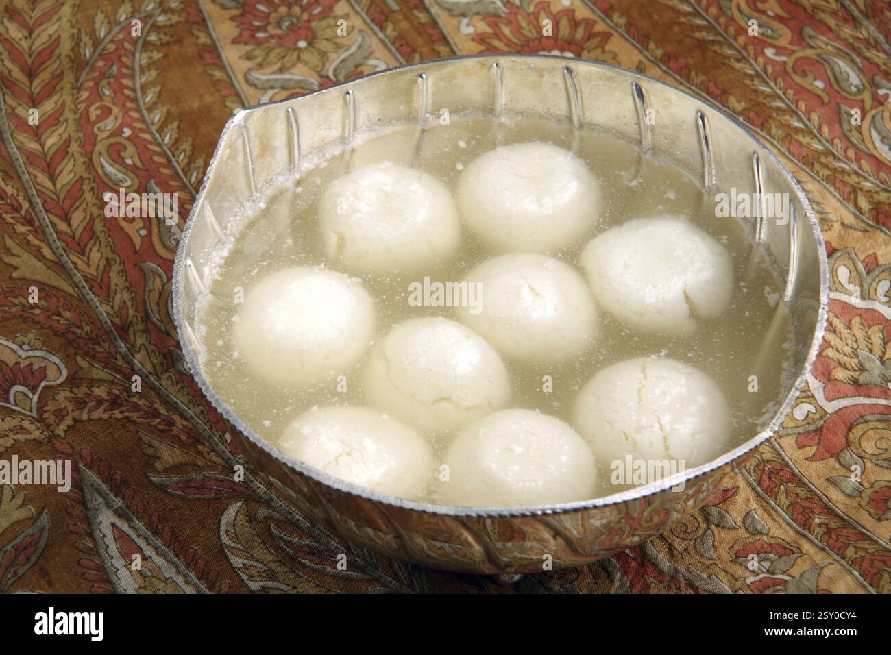Bengali Sweet Rasgulla in Silver bowl India PR#743AH Stock Photo - Alamy