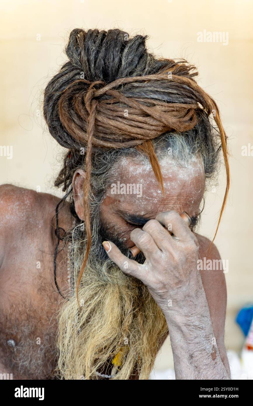 naga hindu saint in sacred trance with marijuana pipe in hand during ...