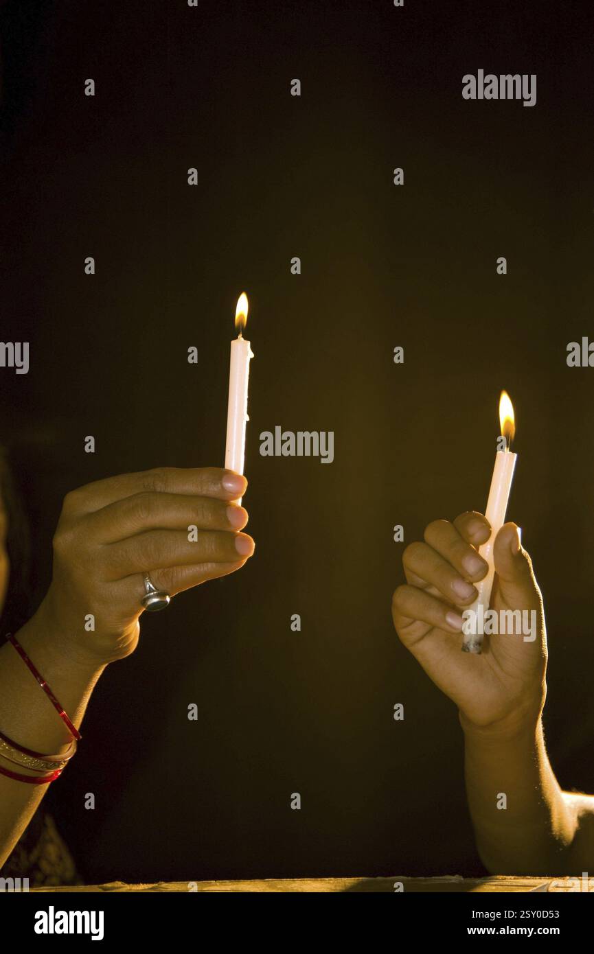 Hand holding candle India Stock Photo - Alamy