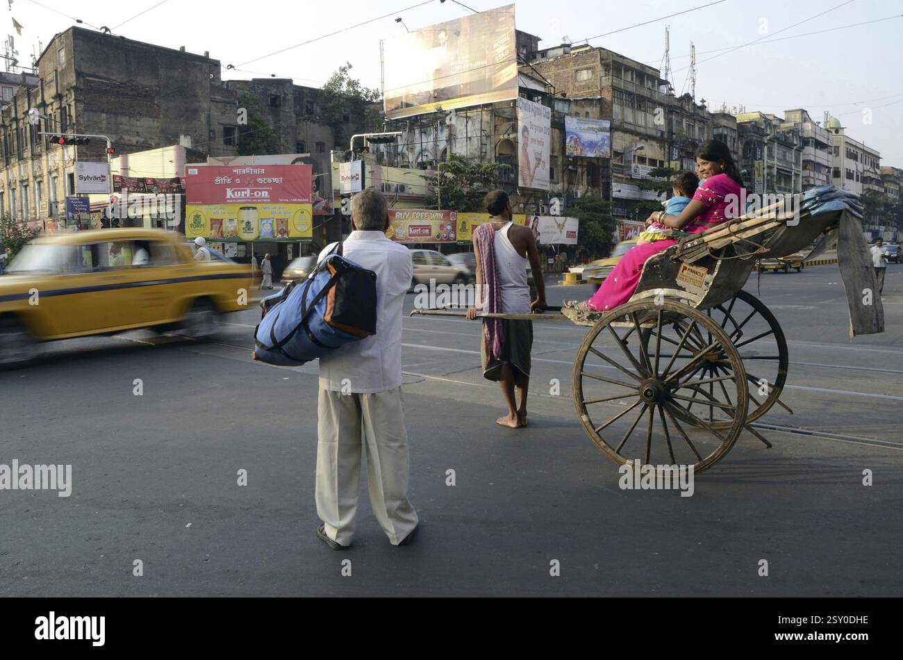 Hand rickshaw puller with passengers at Kolkata India Stock Photo - Alamy