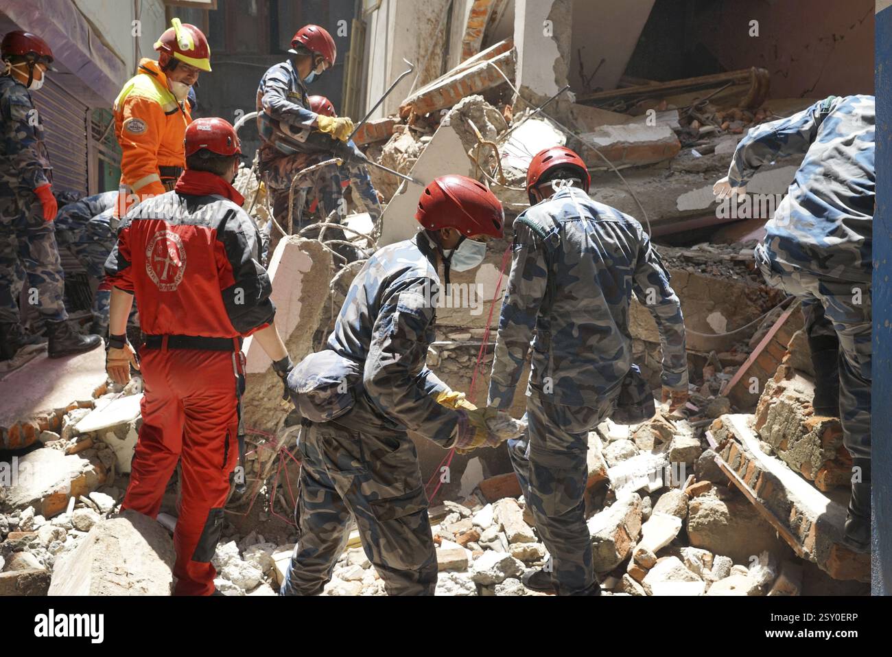 Rescue personnel searching dead bodies, earthquake, nepal, asia Stock ...