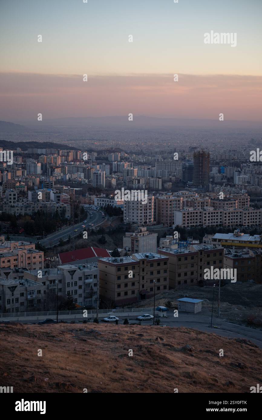 26 February 2025, Iran, Teheran: View of the metropolis at sunset. A ...