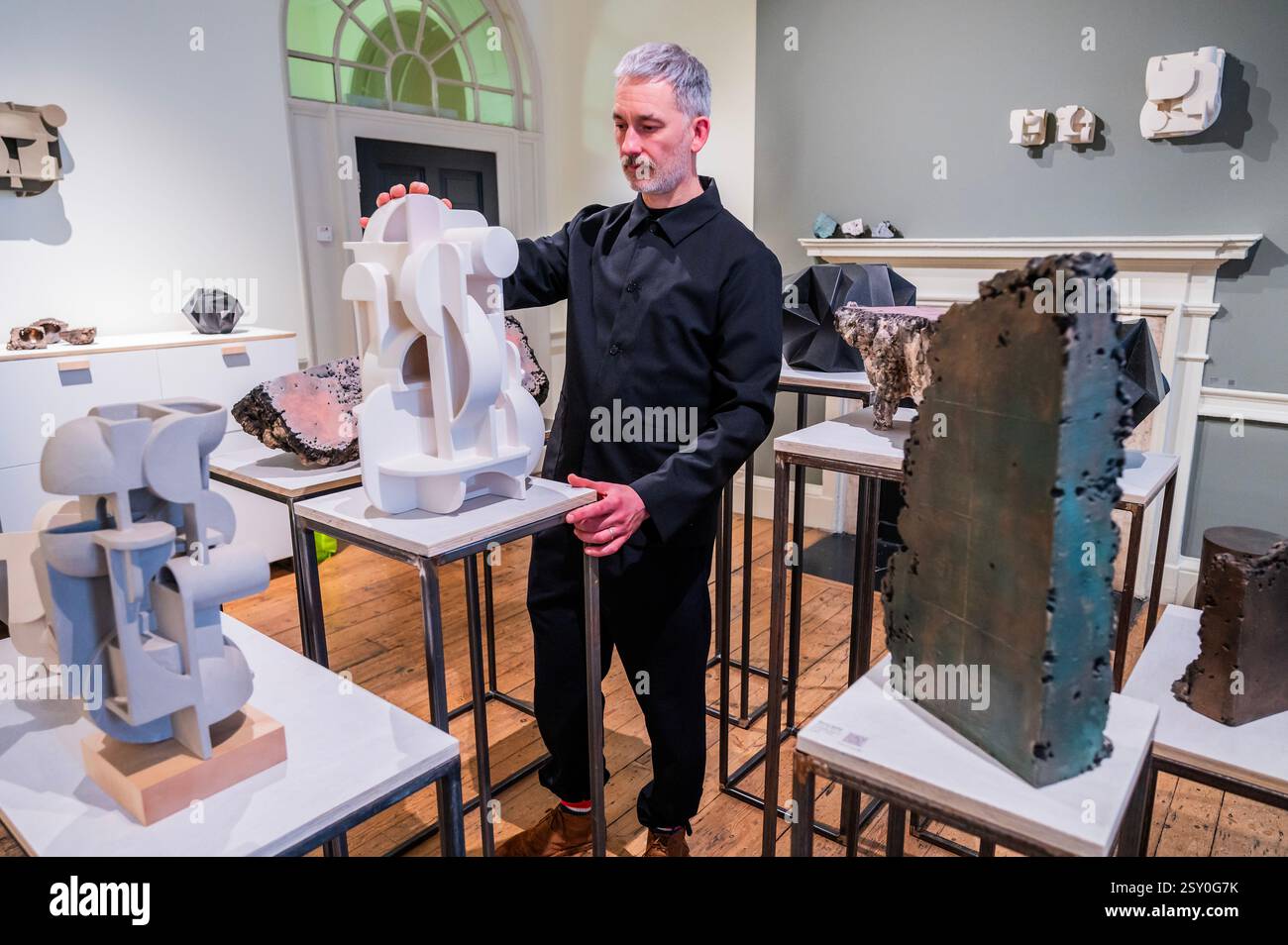 London, UK. 26th Feb, 2025. Derek Wilson with some of his works in the ...
