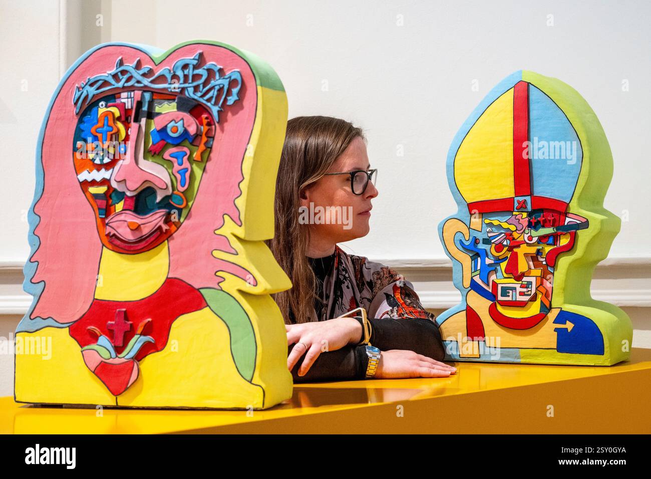 London, UK. 26 February 2025. (L) ‘Jesus Sculpture with Robbie Williams ...