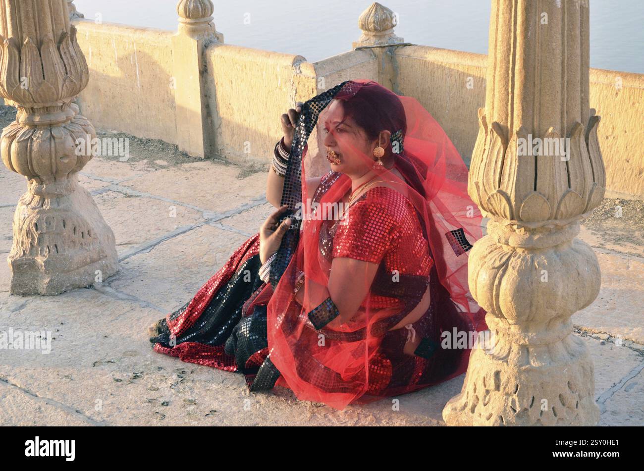 Woman in veil in Rajasthani costume sitting Rajasthan India Asia MR ...