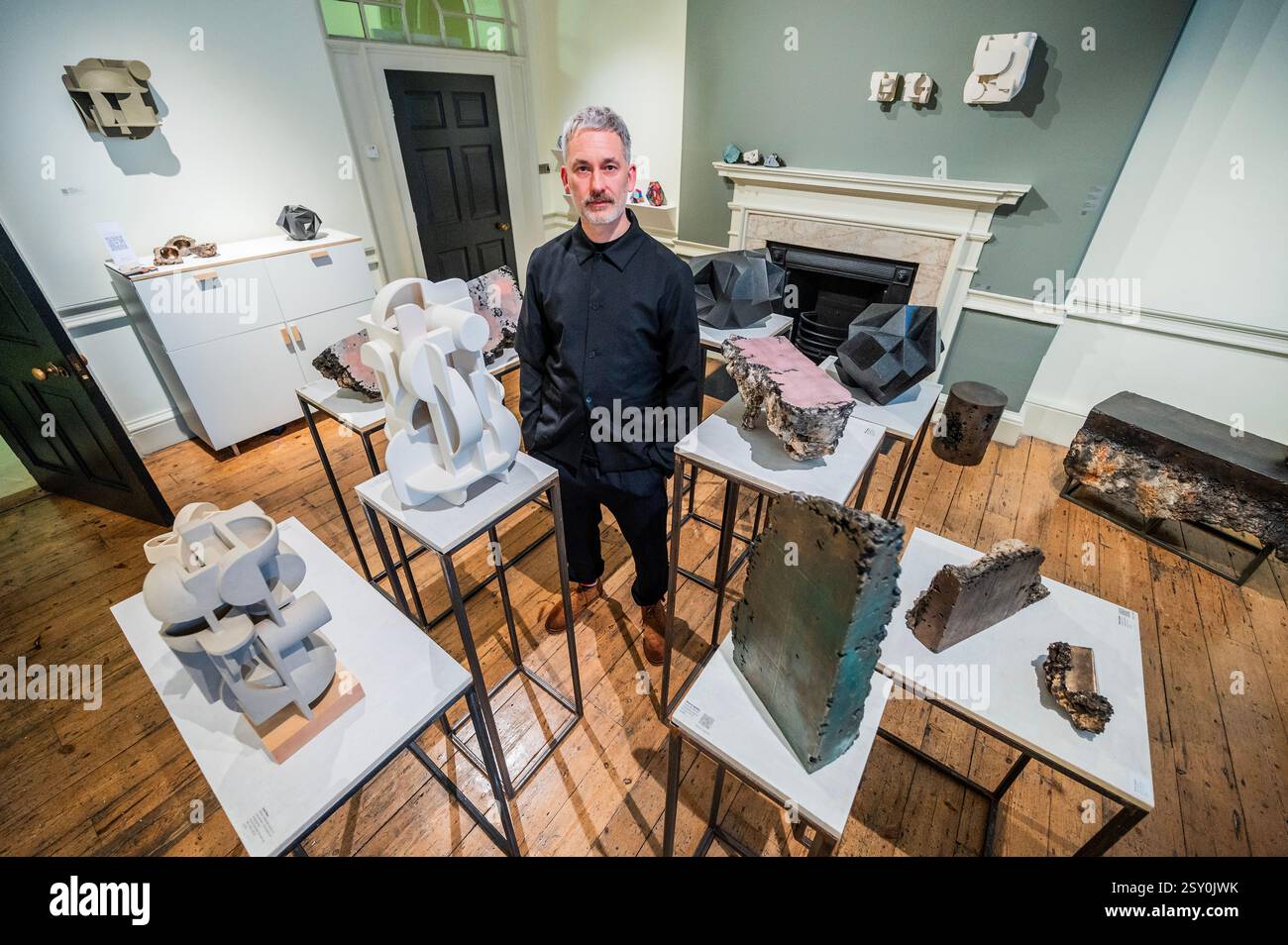 London, UK. 26th Feb, 2025. Derek Wilson with some of his works in the ...