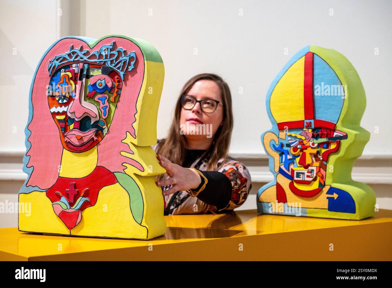 London, UK. 26 February 2025. (L) ‘Jesus Sculpture with Robbie Williams ...
