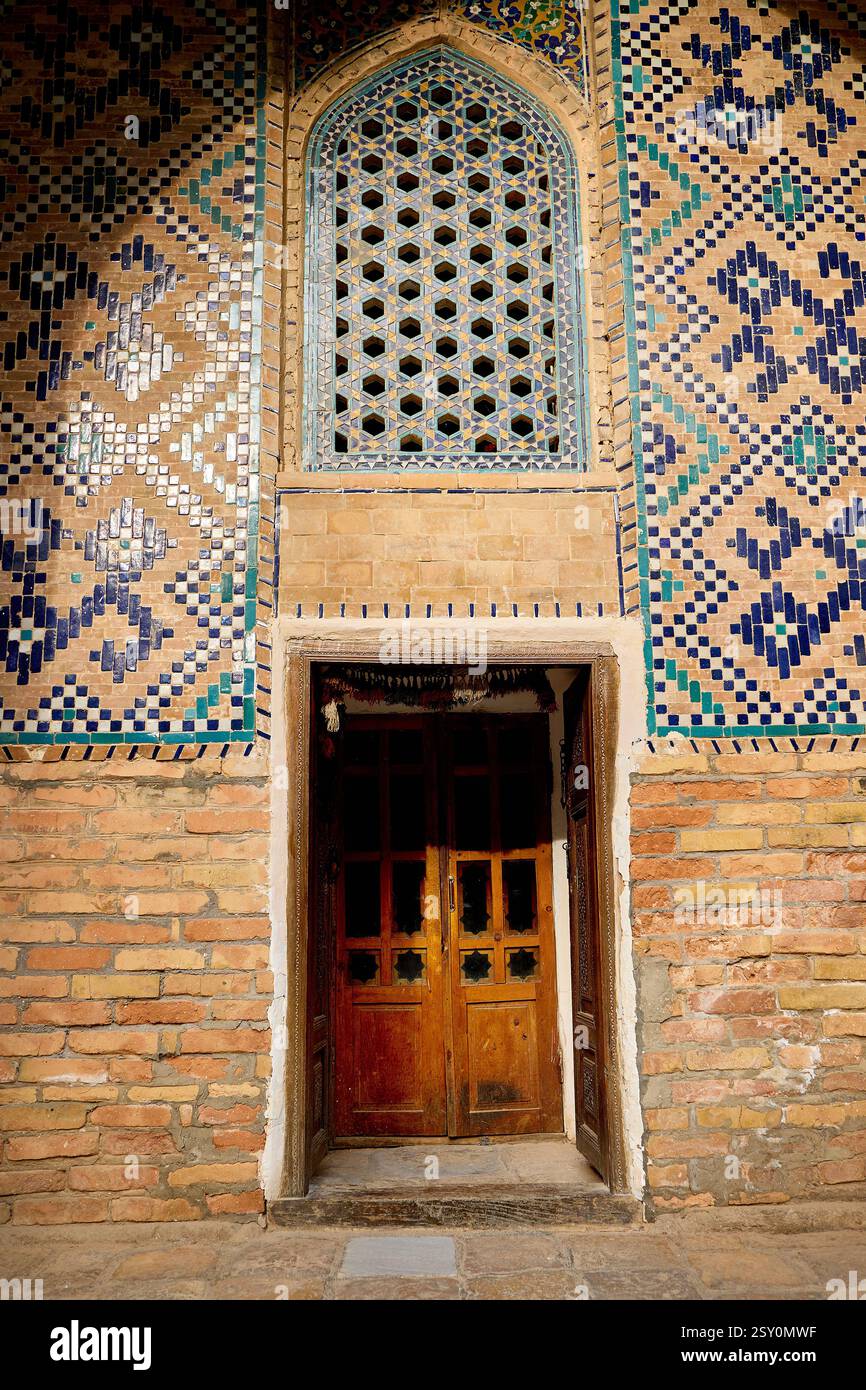 Old wooden door in Beautiful madrassah at Registan old public square ...