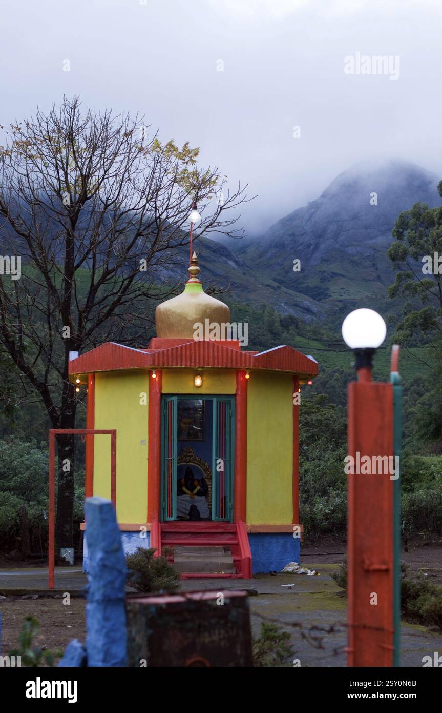 A colourful temple of lord Ganesh with monsoon clouds Munnar Kerala ...