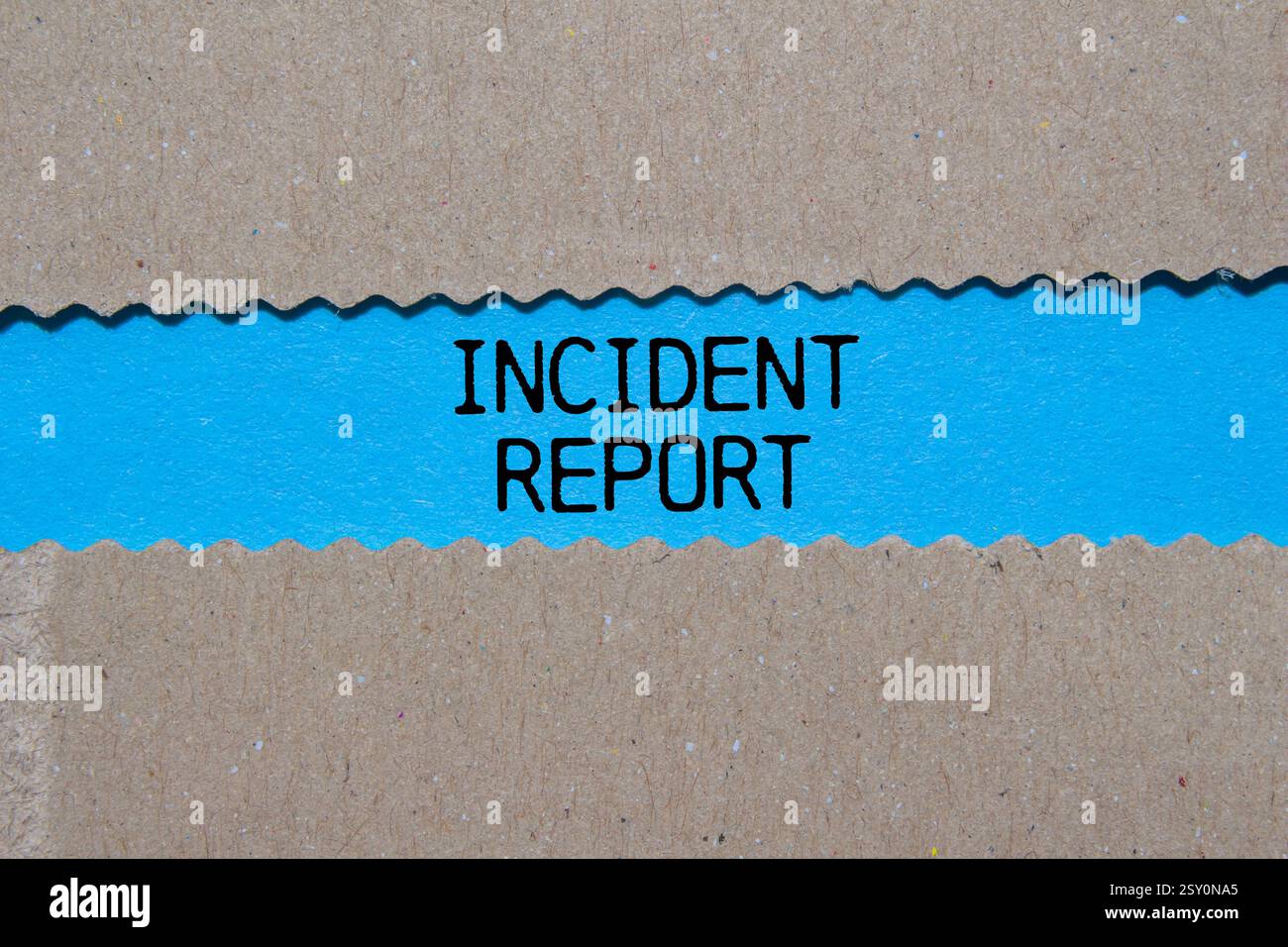 Incident report message written on ripped torn paper on blue background. Conceptual incident ...