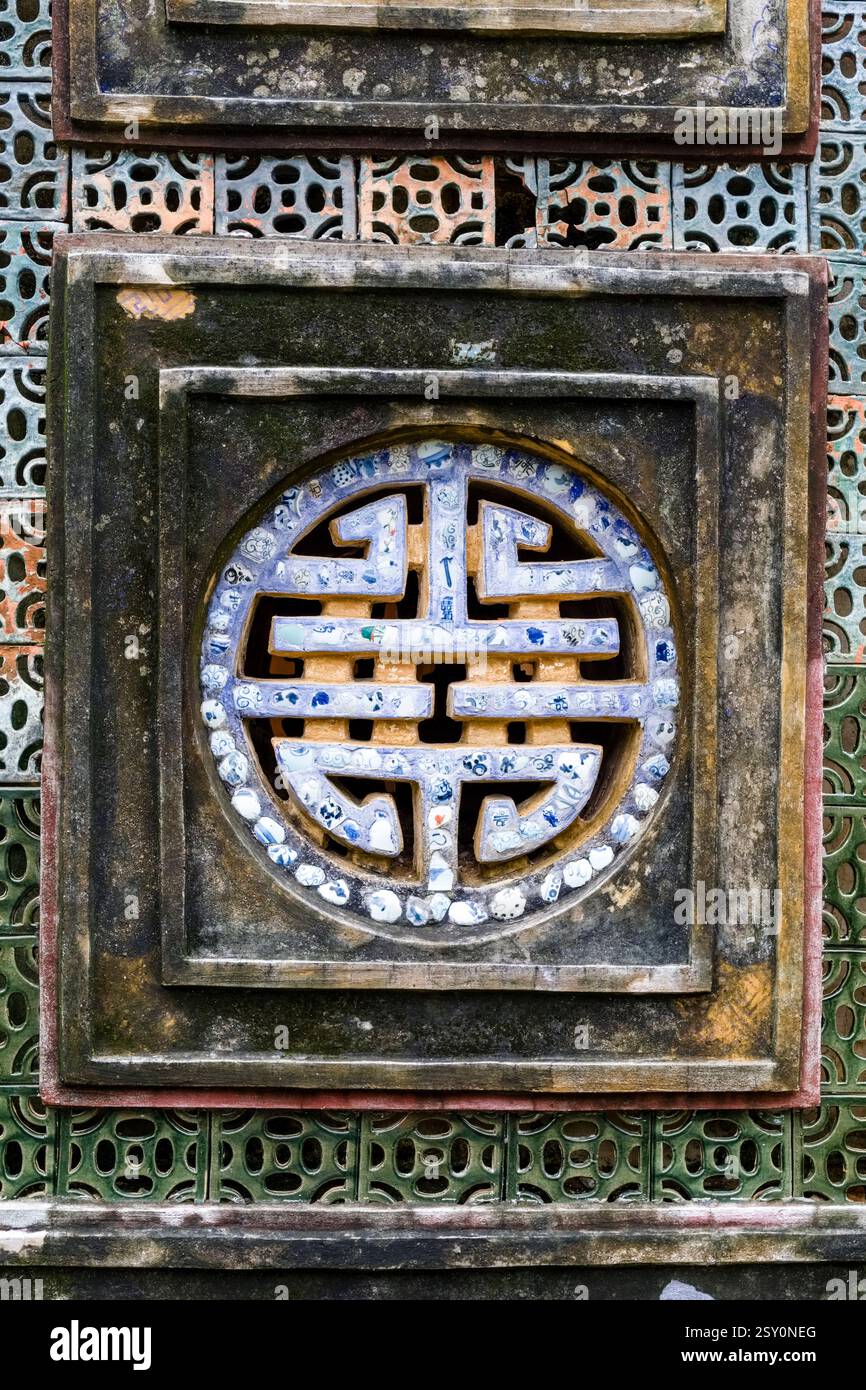 Artfully decorated stone window on one of the stone walls of the tomb ...