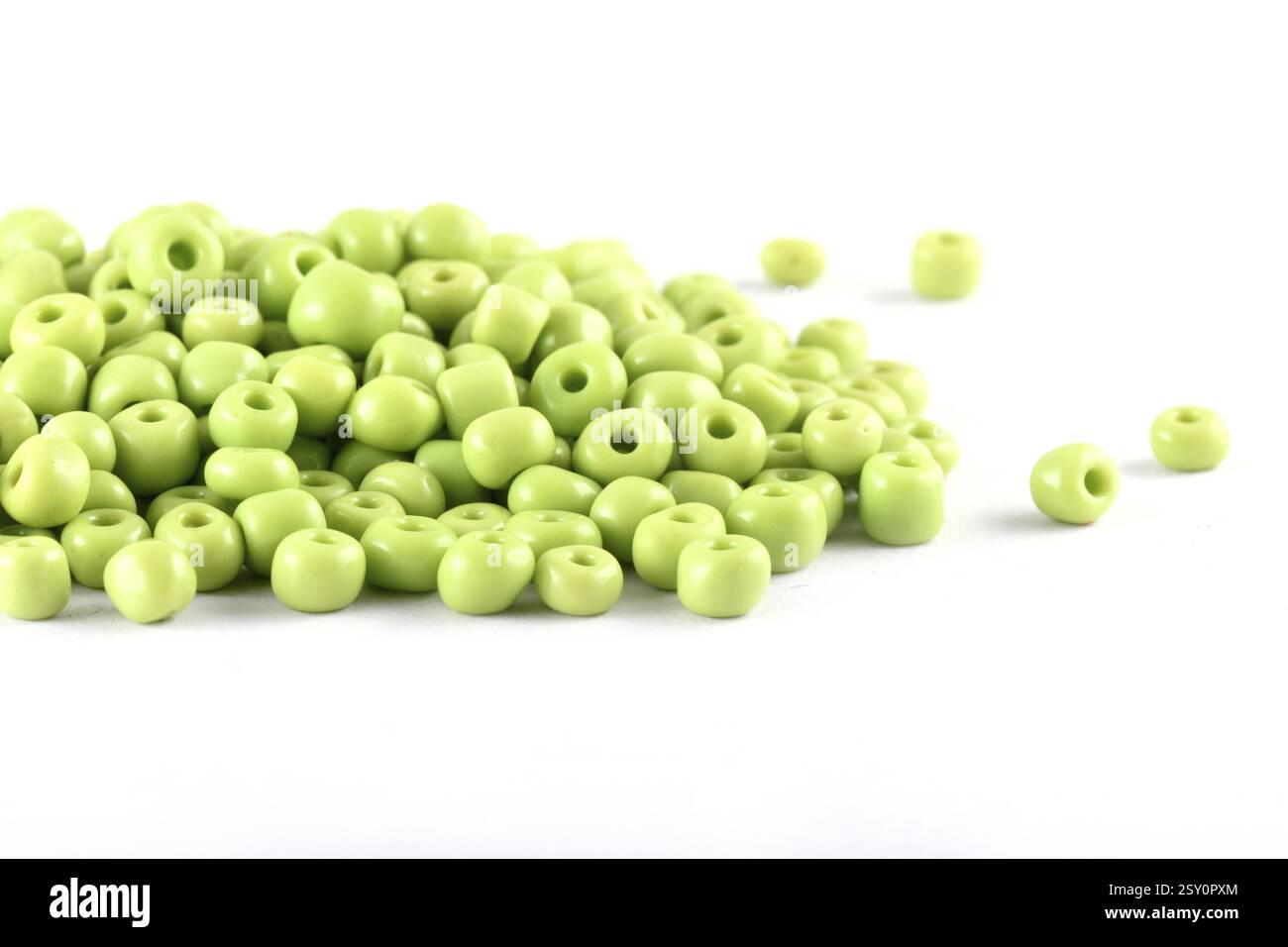 Close up of Light green Beads on the white background. Background or ...
