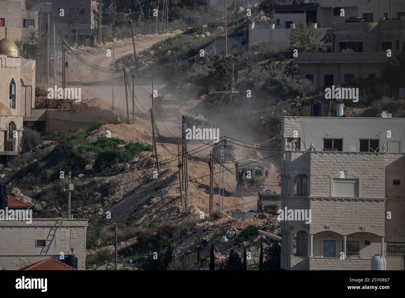 Qabatiya, Palestinian Territories. 26th Feb, 2025. Israeli forces drive ...