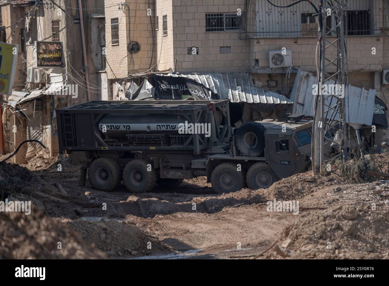 Qabatiya, Palestinian Territories. 26th Feb, 2025. Israeli forces drive ...