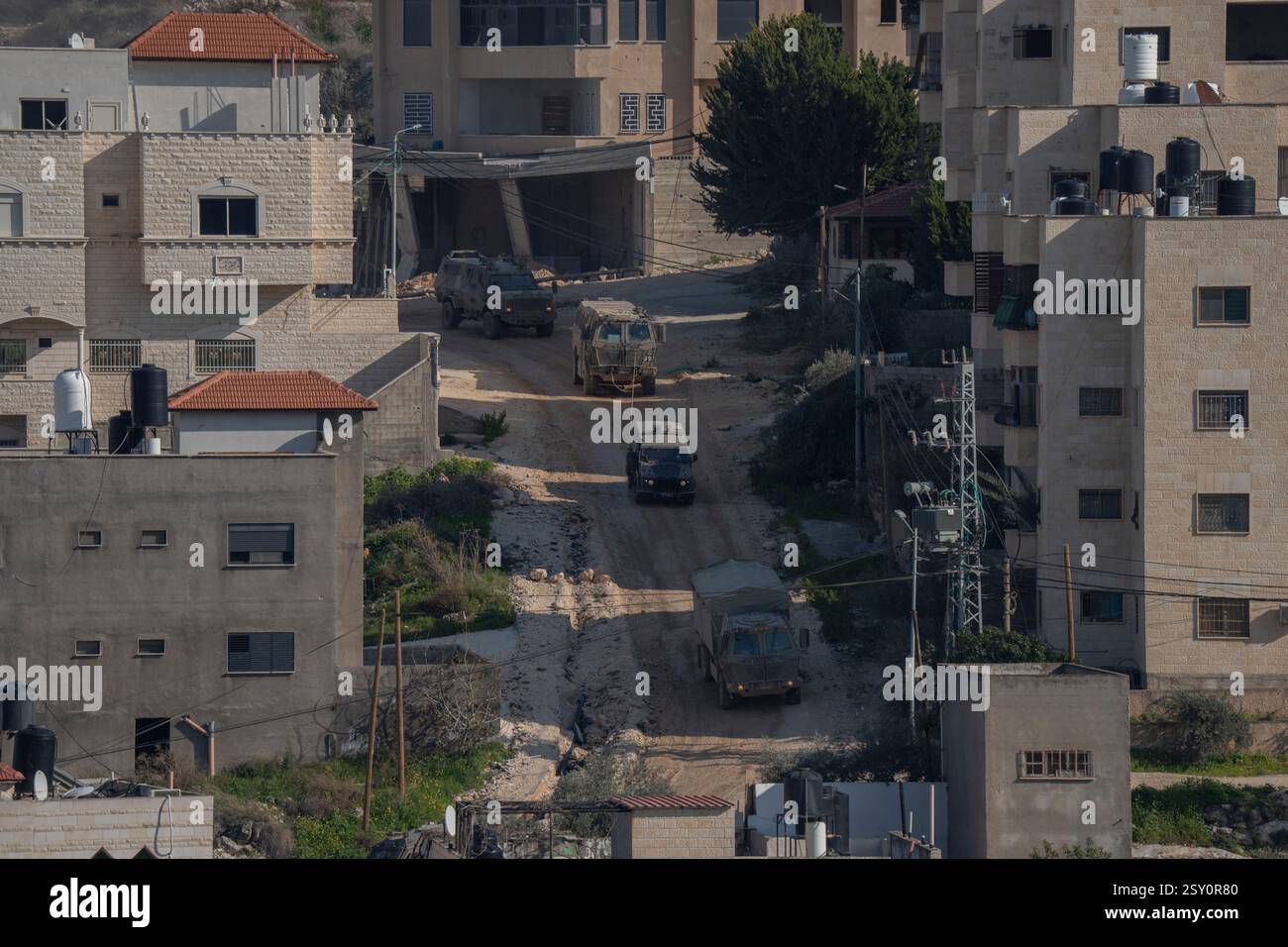 Qabatiya, Palestinian Territories. 26th Feb, 2025. Israeli forces drive ...