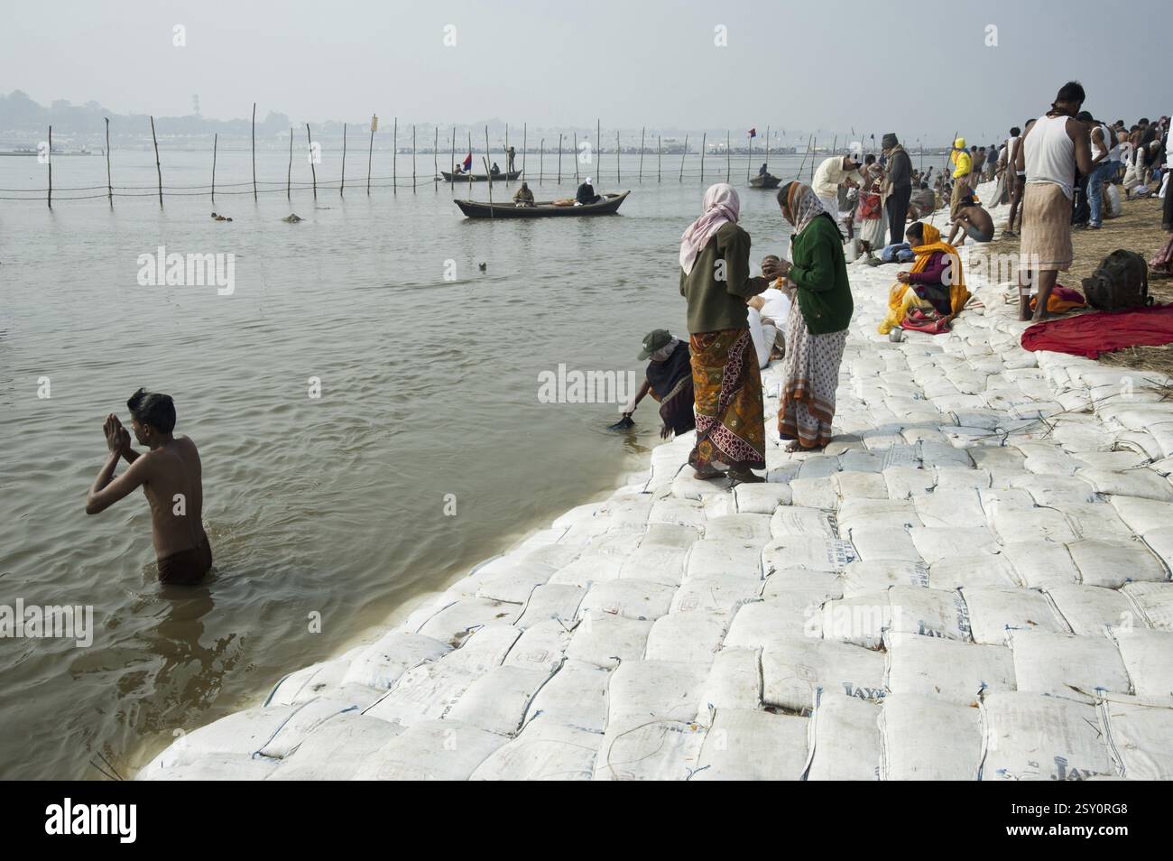 Devotee bathing in ganga river in kumbh mela at uttar pradesh India ...