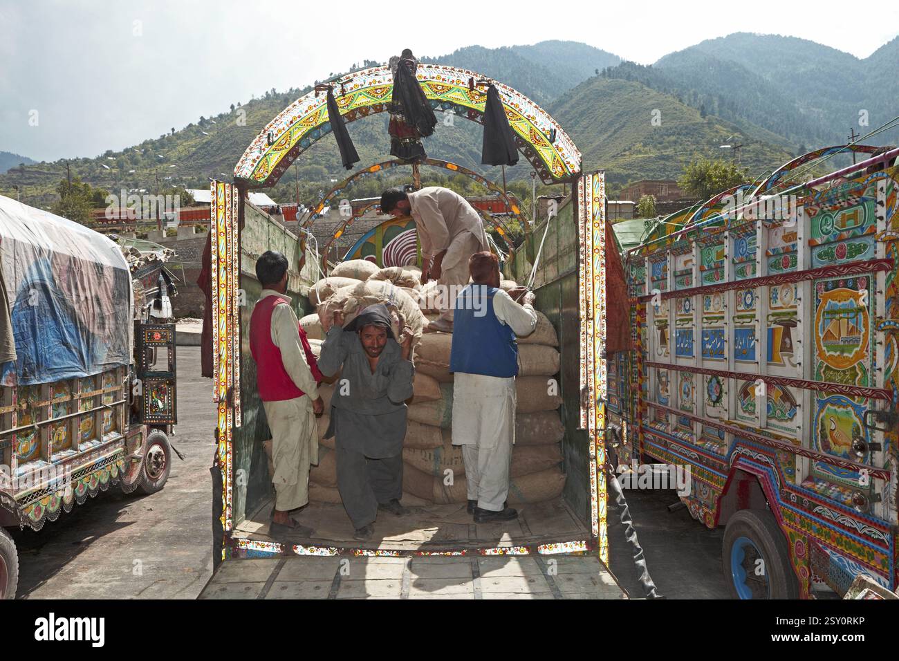 Porters unloading goods arrived in truck, uri, jammu & kashmir, india ...