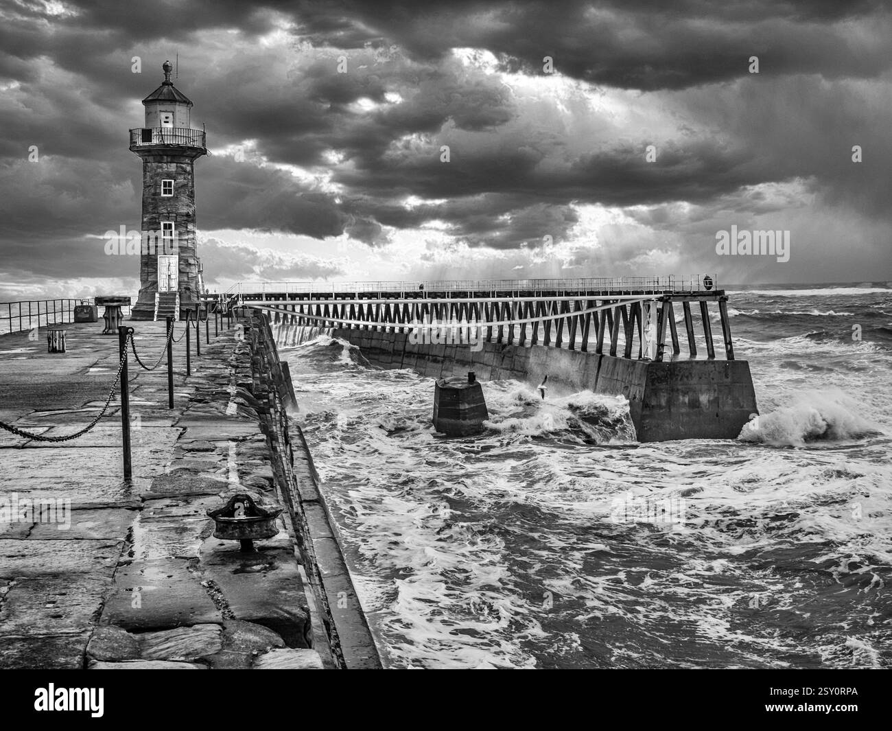 The image is of Whitby harbour lighthouse jetty break water-walls being ...