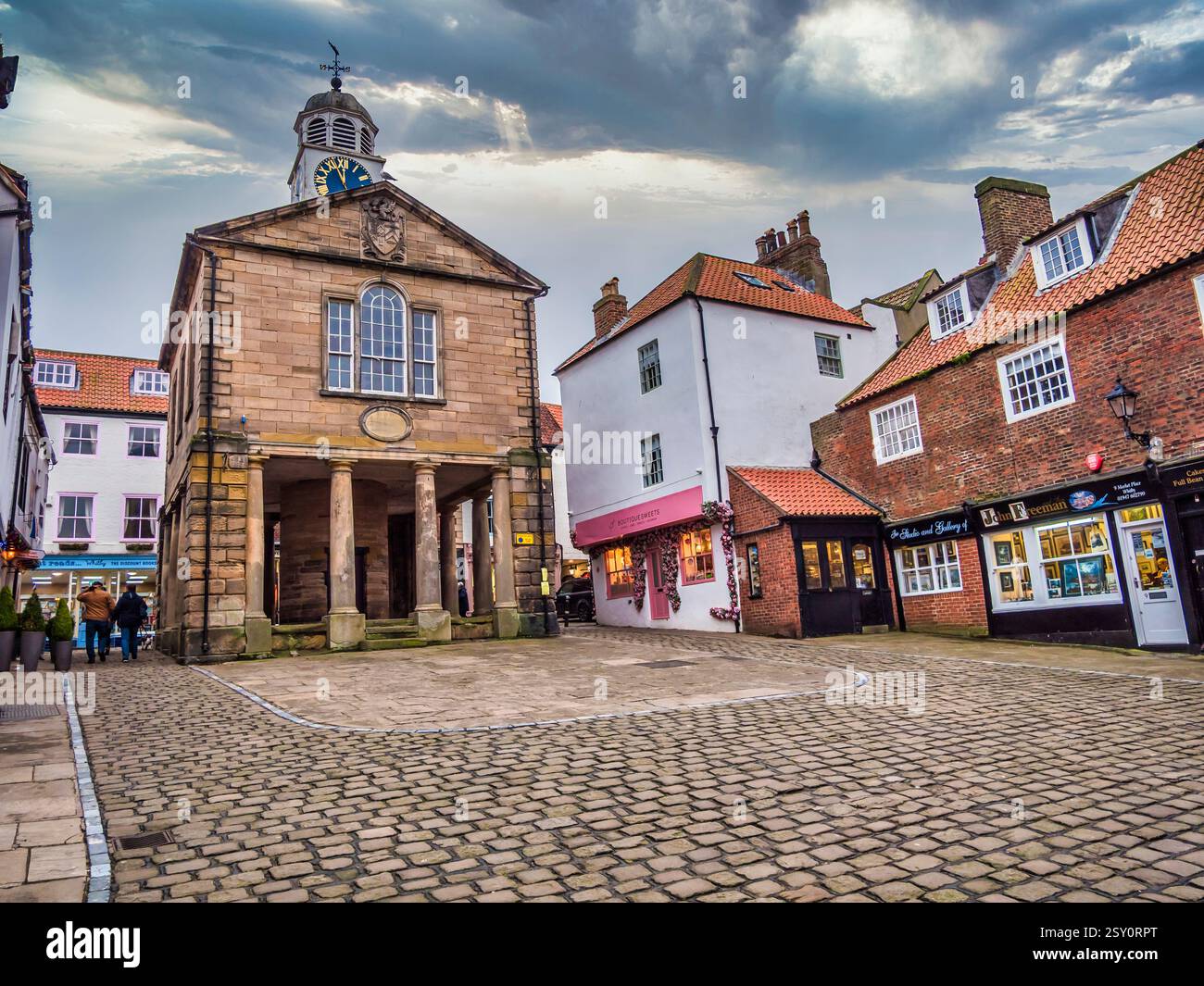 Whitby street scene in the old part of town with the old Town Hall and ...