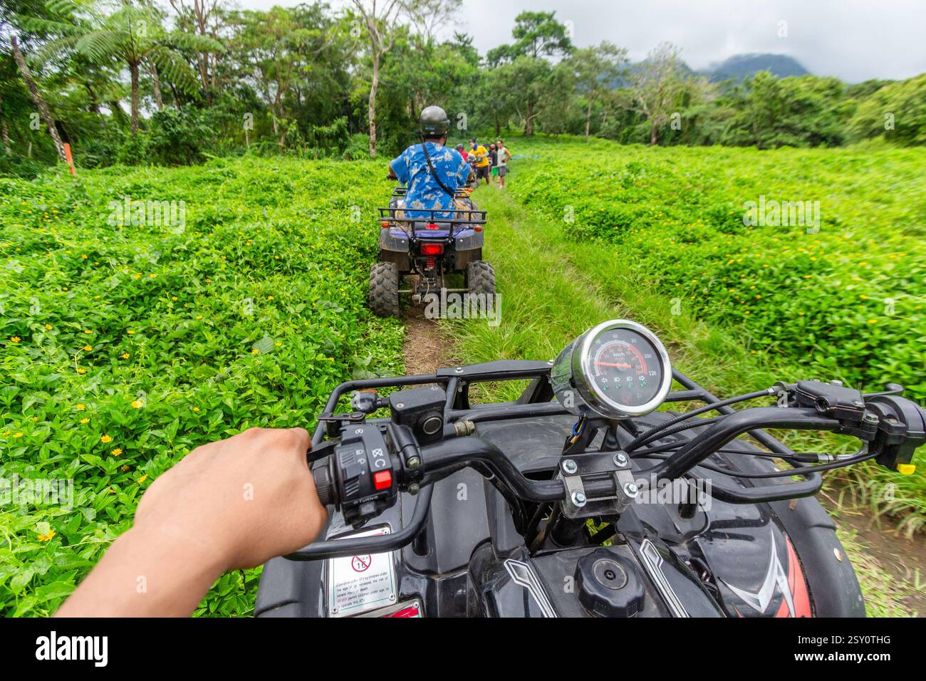 Tourists on ATVs enjoy an exhilarating countryside ride through the ...