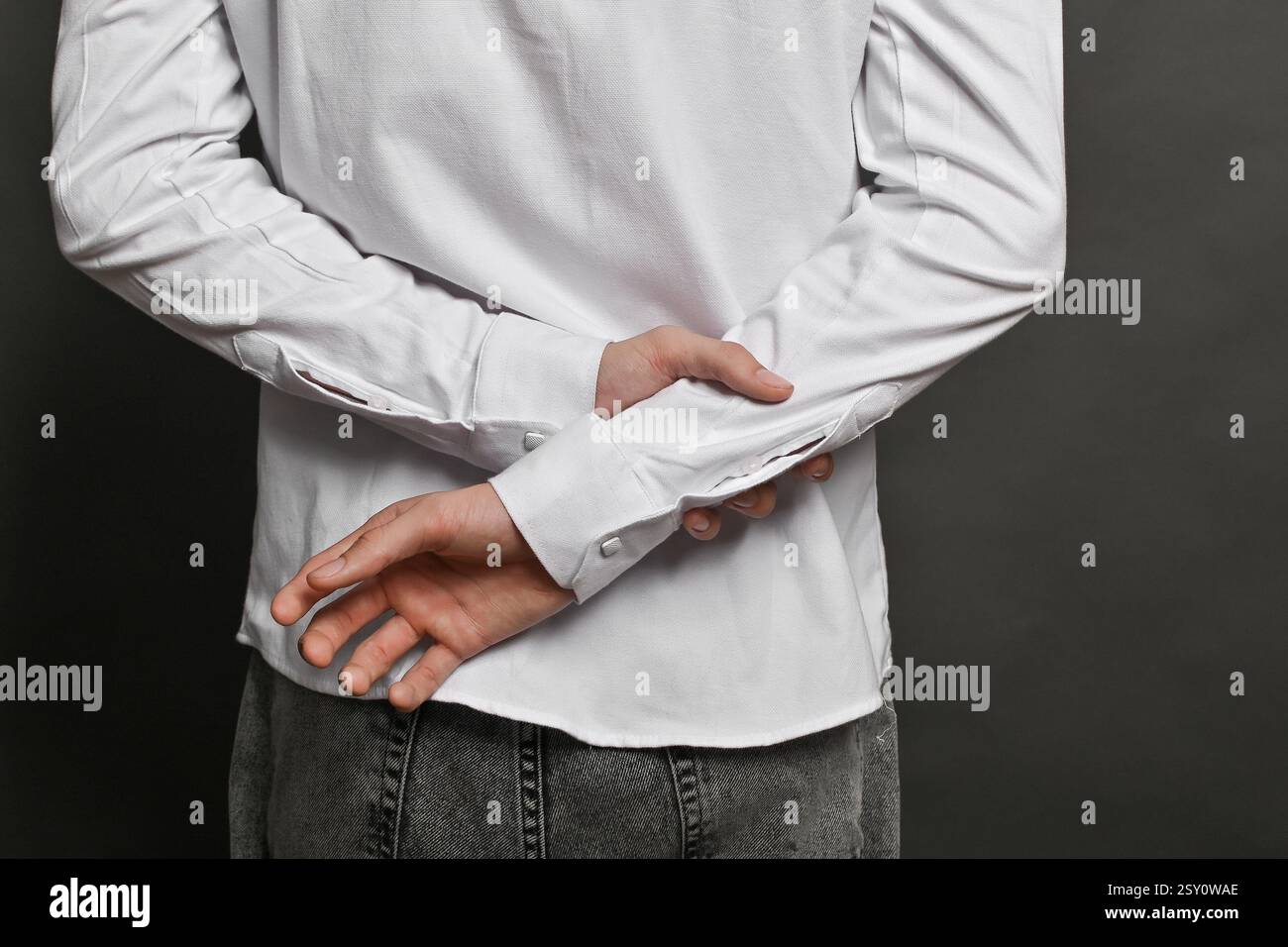 With hands clasped behind his back hi-res stock photography and images ...