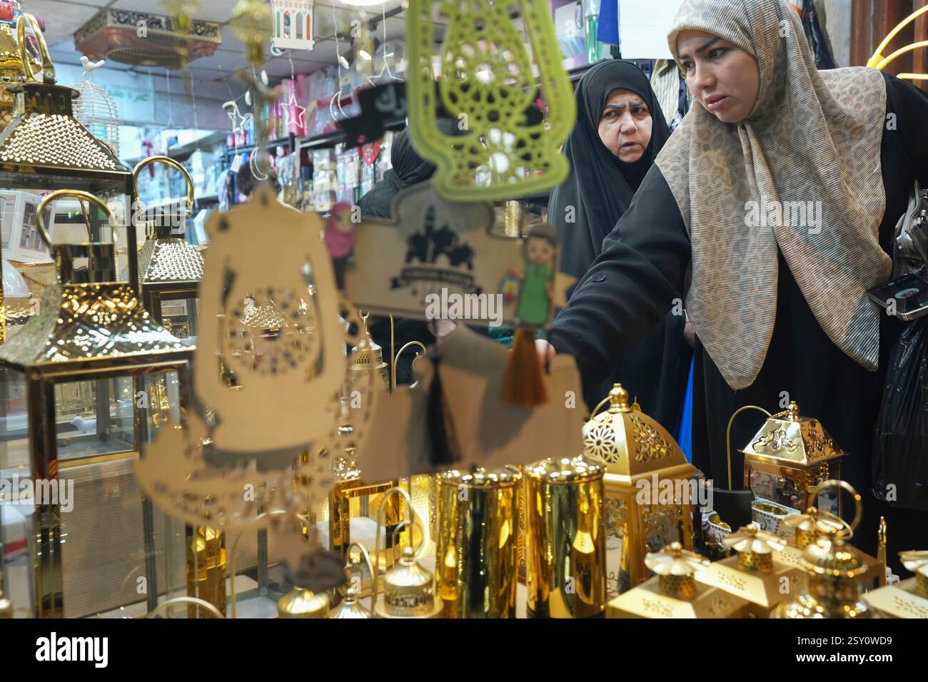 Iraqi people shop for decorative items in a preparation for the Muslim ...