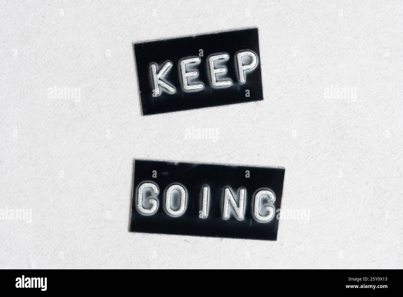Keep Going sign in black and white on white background close up Stock ...