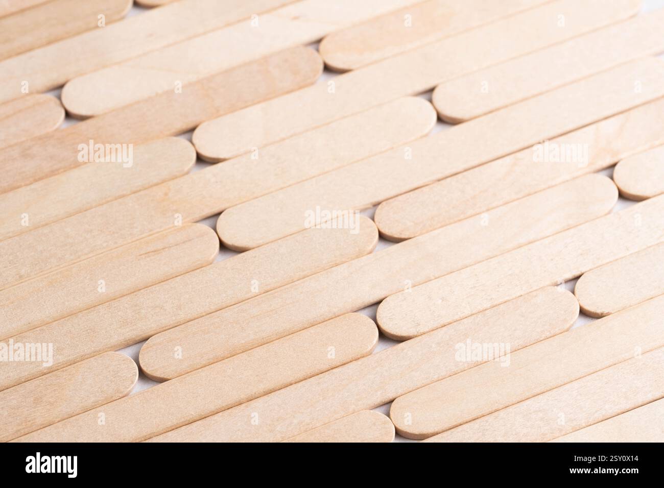 Wooden ice cream sticks on white background. Abstract background and ...