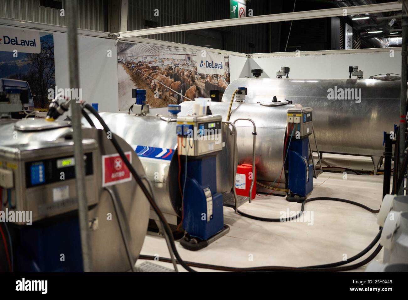 This photo is an illustration that shows the cow milking machines of the brand " DeLaval ...