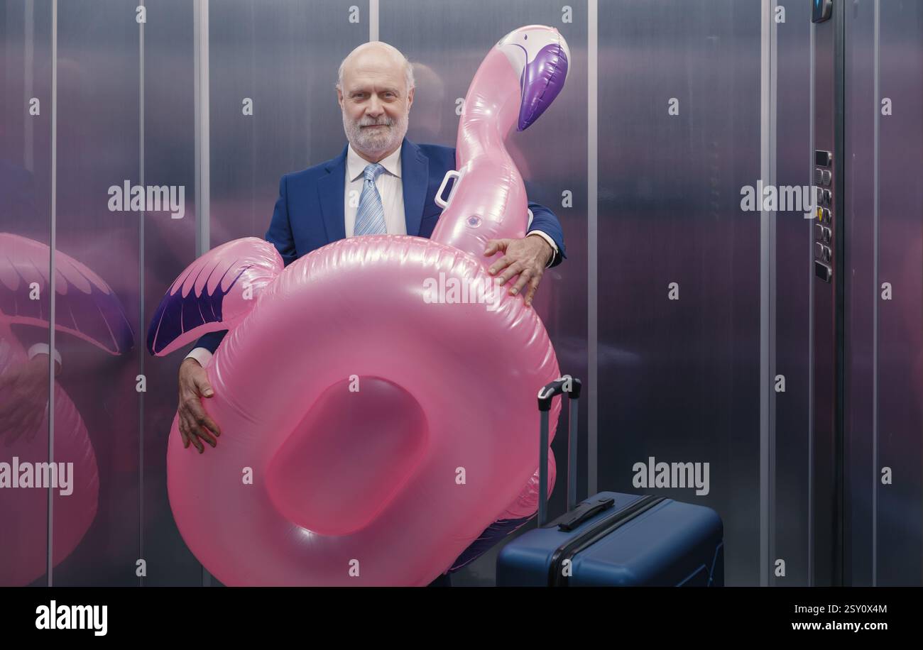 Happy senior business executive leaving for vacations, he is standing ...