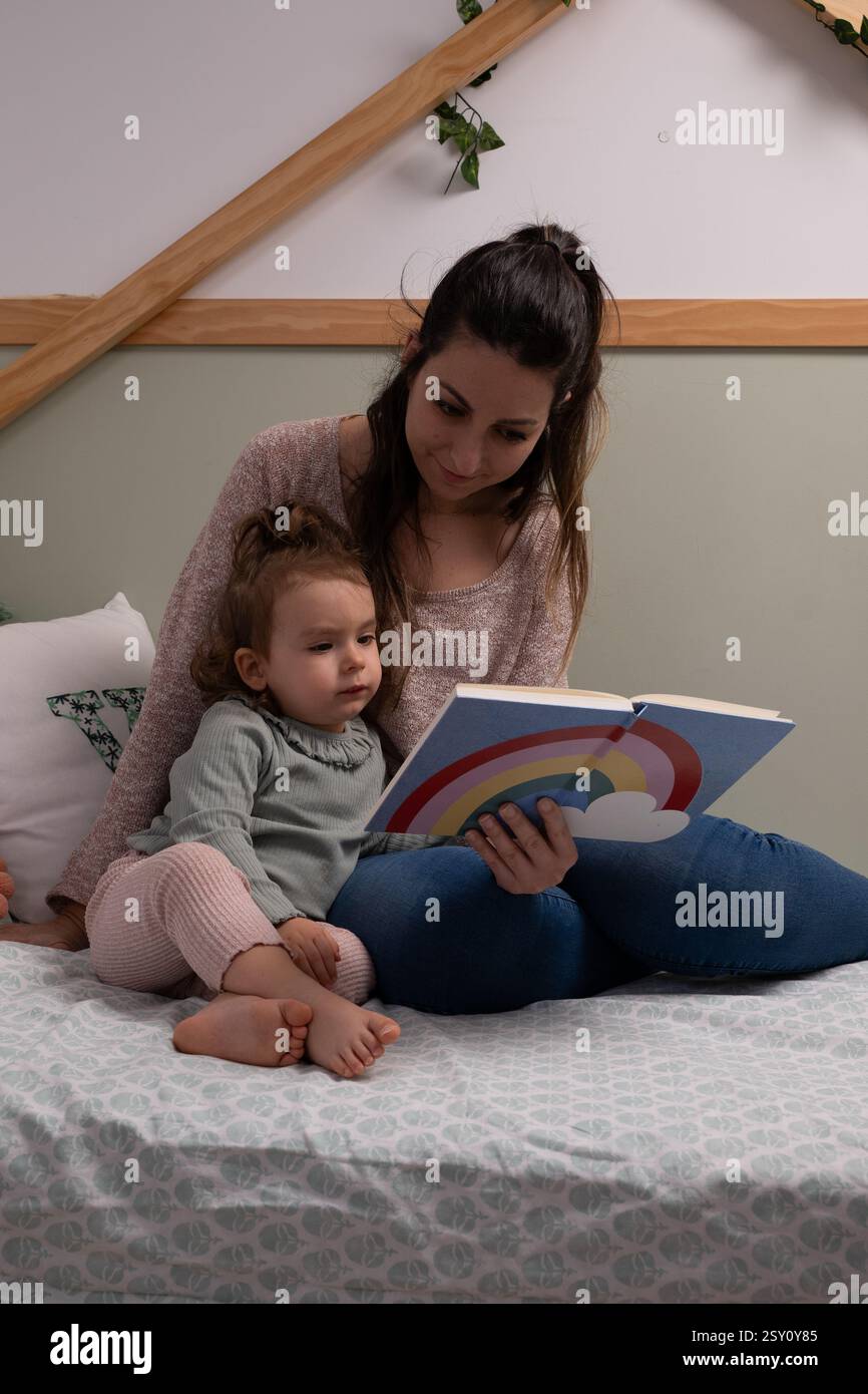 A Special Storytime Moment Between Mom and Daughter Stock Photo - Alamy